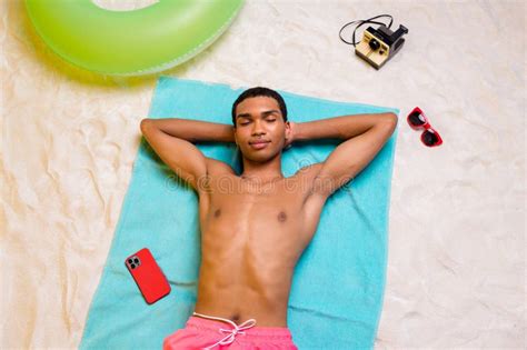Photo Of Dreamy Sweet Shirtless Man Lying Towel Arms Behind Head Sun