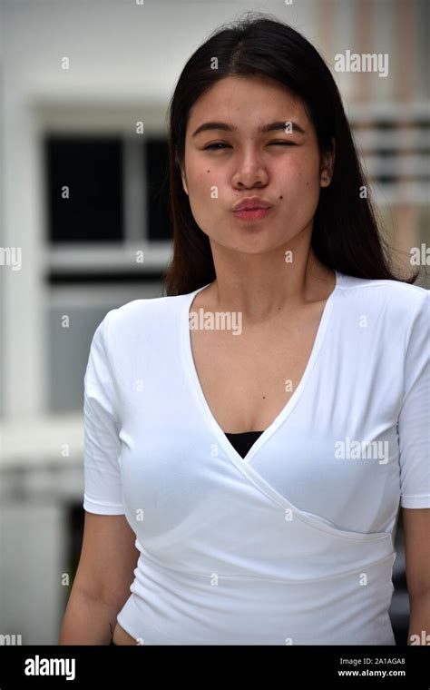 A Beautiful Asian Female Winking Stock Photo Alamy