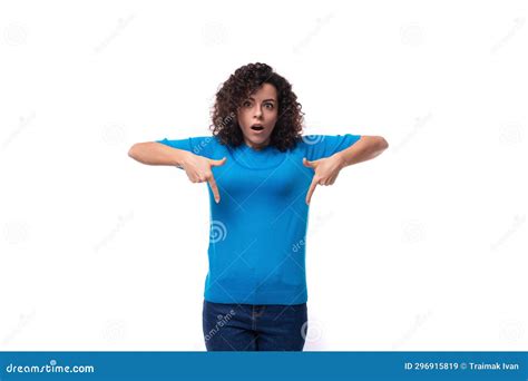 Young Confident Woman In A Blue Short Sleeve Sweater Pointing Her Hand