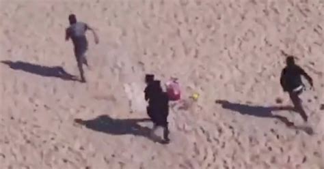 Drug Runners In Speedboat Chased By Cops Before Sprinting Across Packed