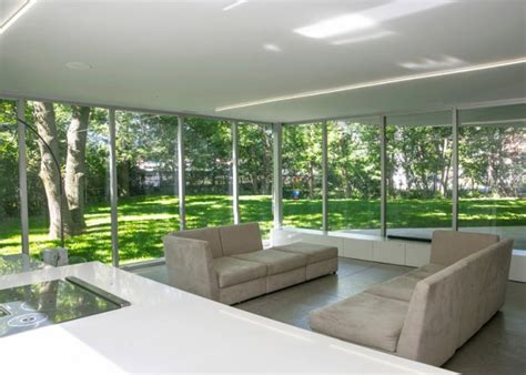 Jean Verville Completes White Washed Clapboard House In Montreal