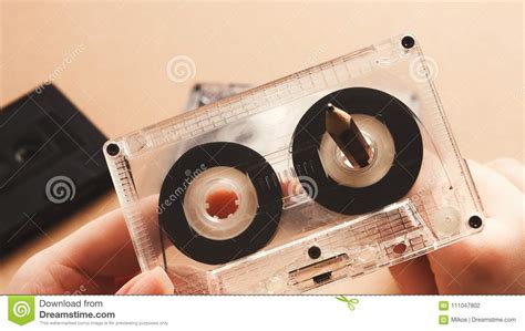 Vintage Cassette And Pencil To Rewind Tape On Brown Background Stock