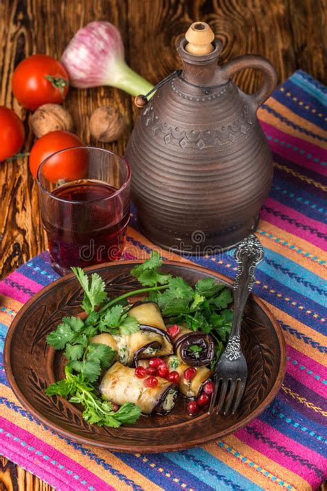 Rolls Of Fried Eggplant With Cheese Garlic Cilantro And Pomegranate
