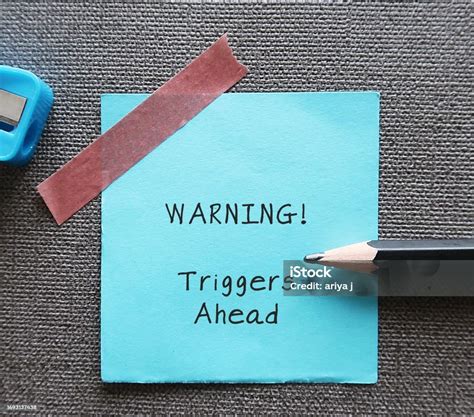 Blue Stick Note With Handwritten Text Warning Triggers Ahead Concept Of Knowing Your Triggers To