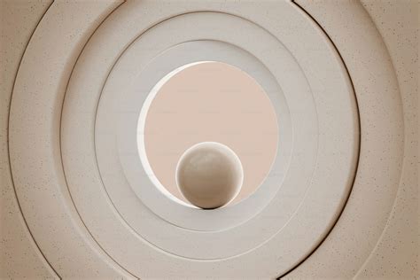 원형 방 중앙에 앉아있는 흰색 공 사진 Unsplash의 중성 톤 이미지