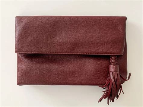 Burgundy Smooth Folded Tassel Clutch The Tiny Details