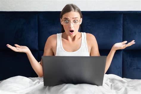 Girl Having Connection Problem Working On Laptop Sitting In Bed Stock Photo Image Of Panic