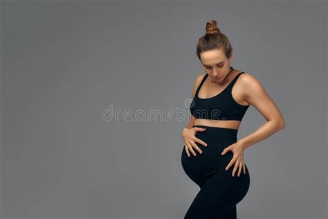 Cute Pregnant Belly Isolated On Gray Side View Of Young Pregnant Woman