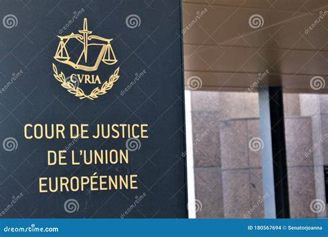 The European Court Of Justice In Luxembourg And Row Of Flags Editorial