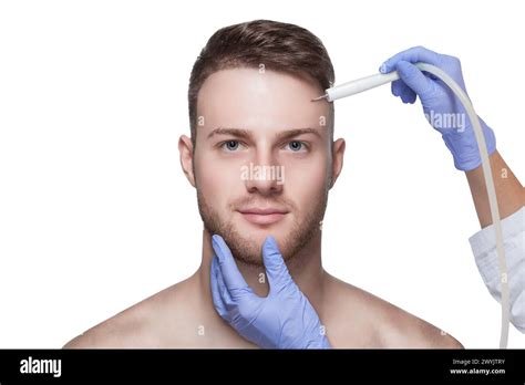 Mens Cosmetology Beautician Makes A Man A Procedure To Remove Acne