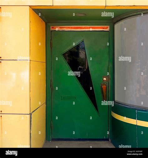 A Mid Century Modern Green Door With A Bold Angular Glass Window Set