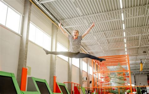 Premium Photo Pretty Girl In Trampoline Park Having Fun