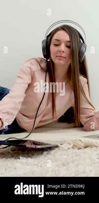 Remote Work Attractive Young Female Interpreter Working From Home Remotely Lying In Comfortable