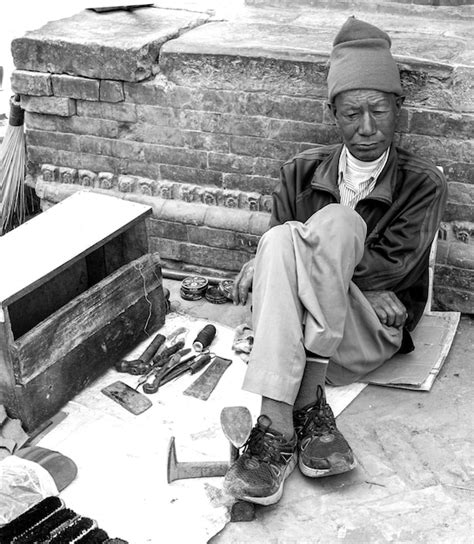Premium Photo Shoemaker Sitting Against Wall