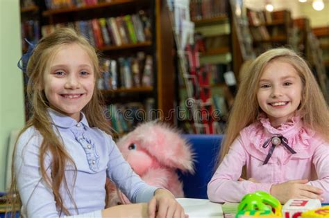 Two Funny Girls Reading Books Library Wooden Alphabet Blocks Stock