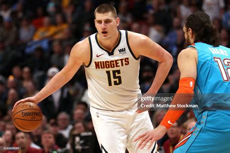 Nikola Jokic Of The Denver Nuggets Drives Against Steven Adams Of The