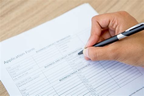 Free Photo Close Up Of Female Hand Filling Application Form