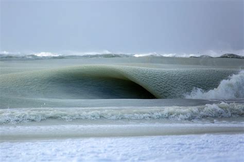 Giant Freezing Waves Infused With Ice Slowly Roll In Off The Coast Of