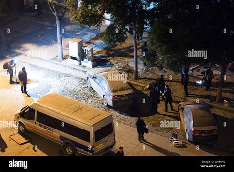 Chinese Police Officers Investigate The Site Of An Explosion In Front Of A Branch Of China