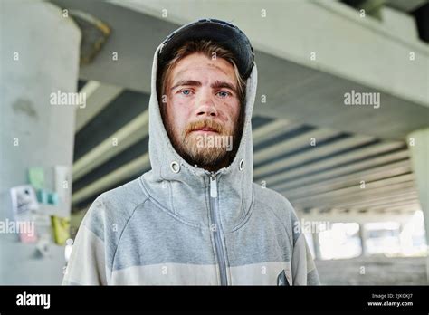 Portrait Of Homeless Poor Man With Alcoholic Bearded Face Looking At