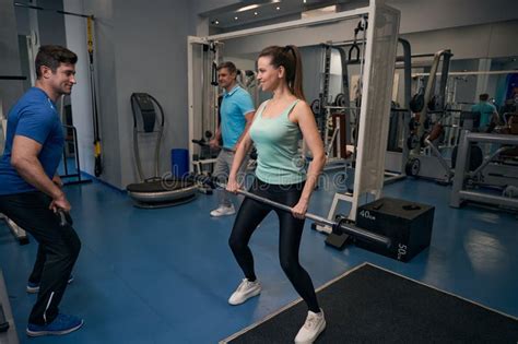 Fit Couple Working Out With Gym Instructor Stock Image Image Of