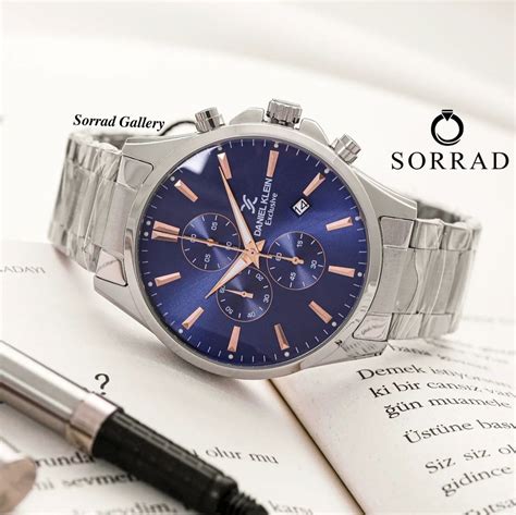 ساعت دنیل کلین مردانه کورنوگراف بند استیل رنگ سیلور صفحه سرمه ای