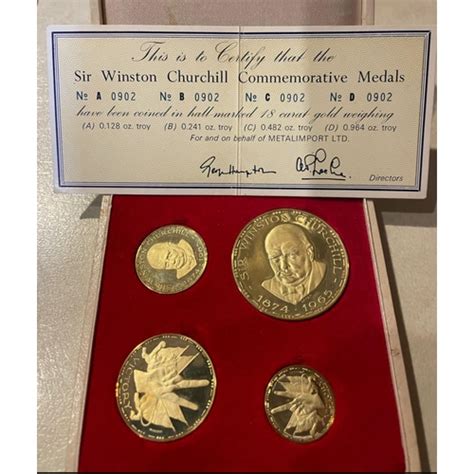 A Set Of Four Sir Winston Churchill 18ct Gold Commemorative Medals By