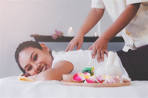 Female Masseur Giving Asian Female A Thai Back Massage In Thai Relaxing