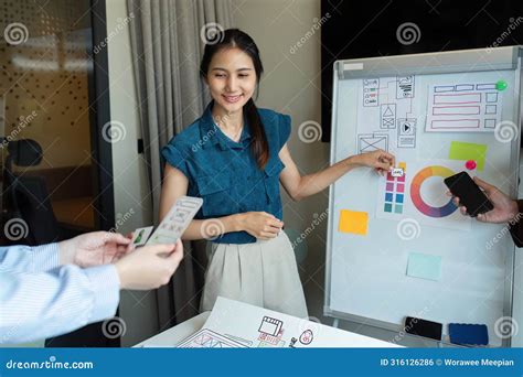 Ux Developer And Ui Designer Team Brainstorm Together About Designing Application Interface