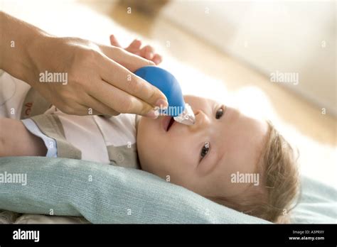 Baby Having Nose Cleaned Up Stock Photo Alamy