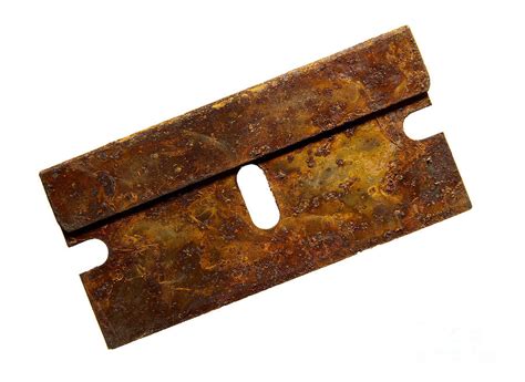 Rusty Razor Photograph By Tony Cordoza