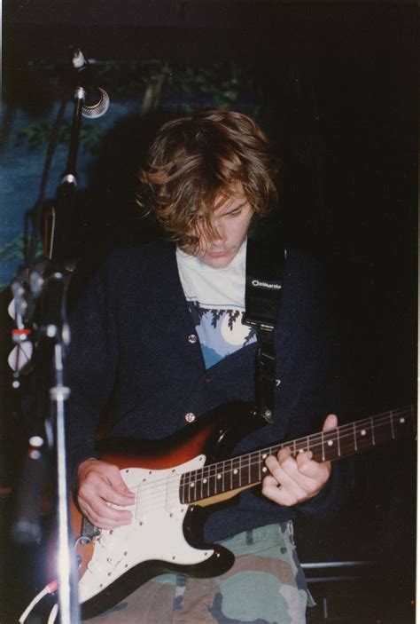 A Young Man Is Playing An Electric Guitar