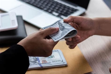 Premium Photo Two Businessmen Doing Corruption Using Money To Bribe Corruption In Business