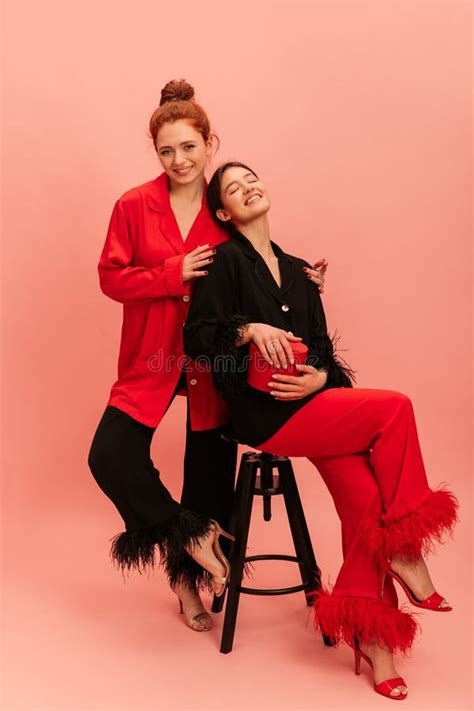 Full Length Two Nice Young Caucasian Girls Brunette And Redhead Pose On