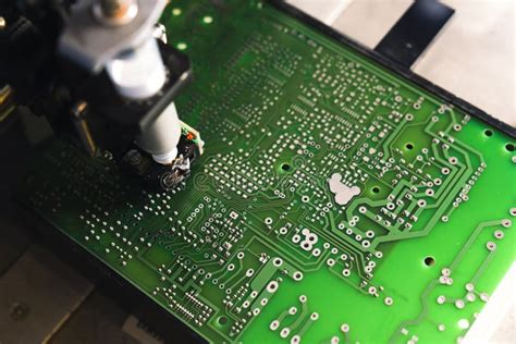 Close Up Of Soldering Process Dispenser Machine Putting Solder Onto
