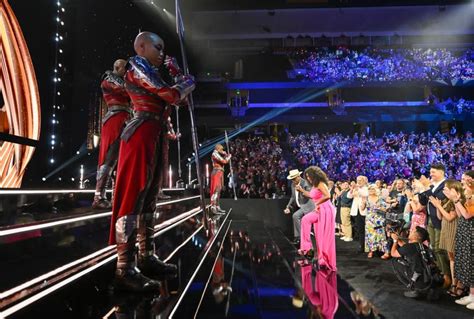 Angela Bassett Puts Regal Spin On Strapless Pink Top With Flowing Train