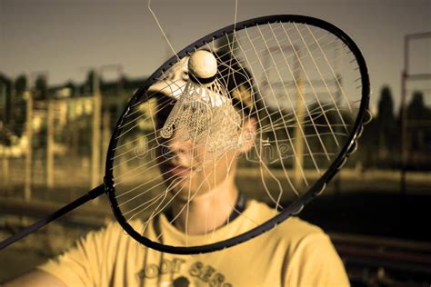 Torn Tennis Badminton Racket With Stuck Shuttlecock Inside During Play