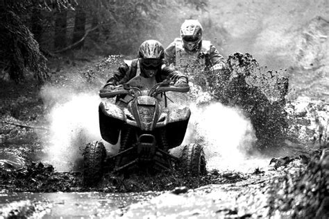 Premium Photo Racers Riding Quadbikes In Mud