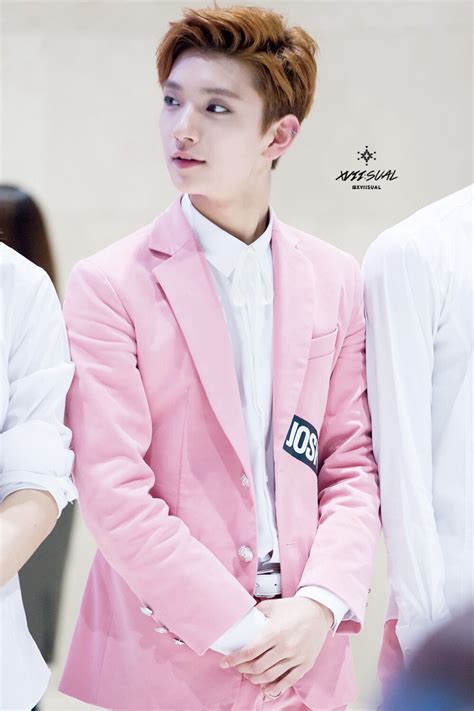 A Man In A Pink Suit And White Shirt