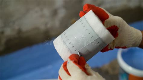 Construction Worker Installing Waterproofing Membrane On Pipe Stock