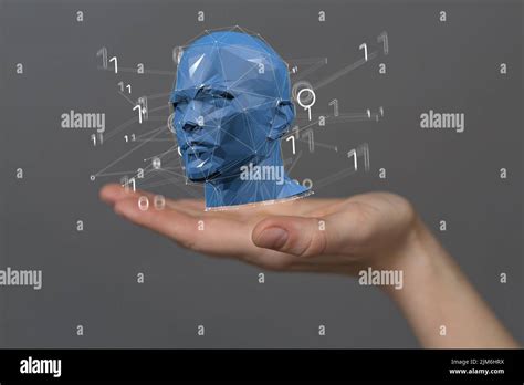 A Businessmans Hand Holding A Digital Render Of A Human Head Hologram