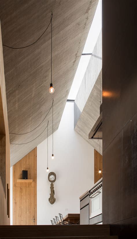 Dekleva Gregorič Arhitekti Builds Wooden House With Chimney Shaped Skylight