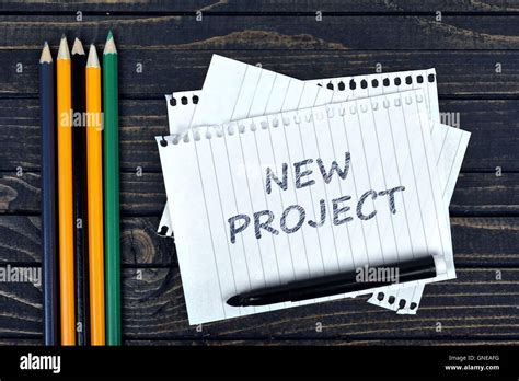 New Project Text On Notepad And Office Tools On Wooden Table Stock
