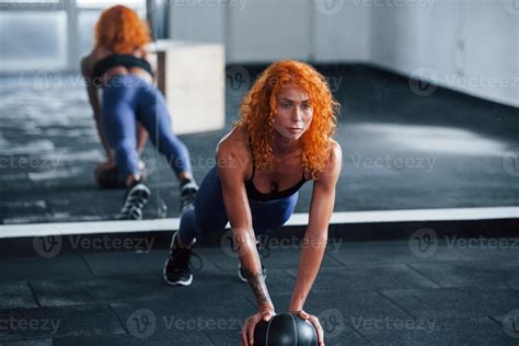 Doing Push Ups With Ball Sporty Redhead Girl Have Fitness Day In Gym