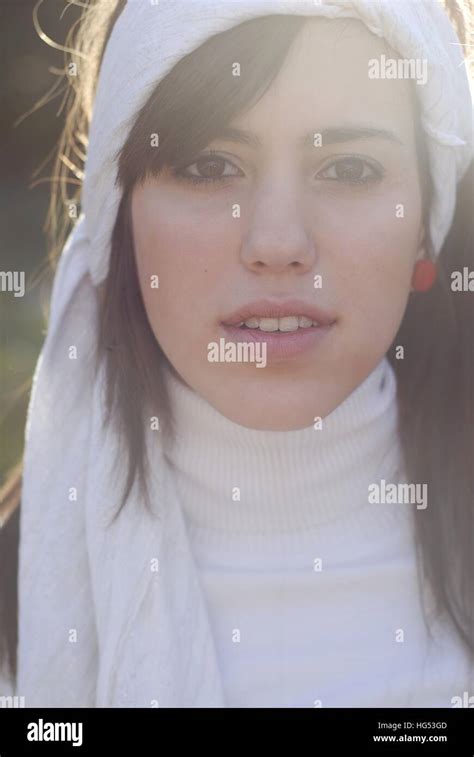 Portrait Of A Cute And Sweet Spanish Teenager Girl Outdoors In A Park