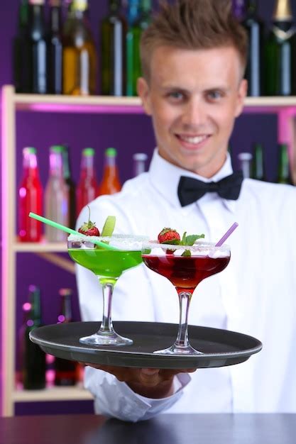Premium Photo Portrait Of Handsome Barman With Different Cocktails