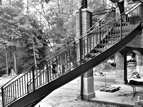 Monumental Curved Stairs And Glass Deck Rail Great Lakes Metal