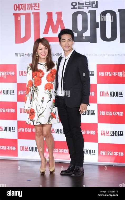 South Korean Actress Uhm Jung Hwa Left And Actor Song Seung Heon Pose