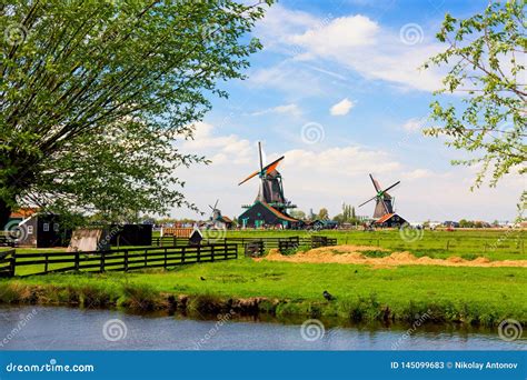 Dutch Typical Landscape Traditional Old Dutch Windmills With Blue