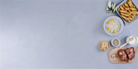 Overhead Shot Of A Meal Featuring Meat Pasta Vegetables And Assorted Sauces On A Grey